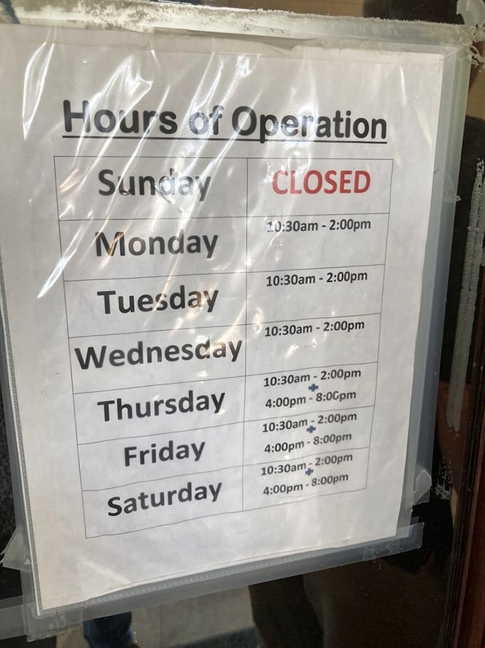 The hours of operation sign—or as locals call it, "times when it's acceptable to show up hungry and leave happy."