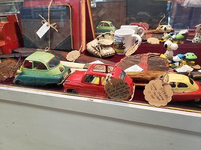 Tiny cars with big stories. Each miniature vehicle bears a handwritten tag – the kind of personal touch that makes antique shopping a human experience.