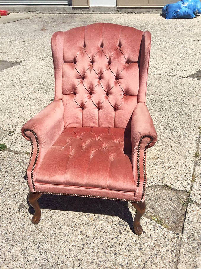The throne of thrift royalty! This mauve velvet wingback isn't just a chair—it's where you'll sit to write your memoir.