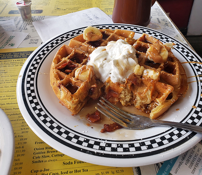 This waffle doesn't just come with toppings—it comes with a philosophy: life is short, eat the whipped cream first.