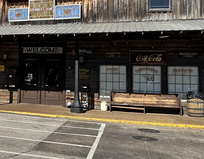 The welcoming storefront beckons travelers with vintage Coca-Cola signs and wooden benches—a front porch philosophy that says "come sit a spell."