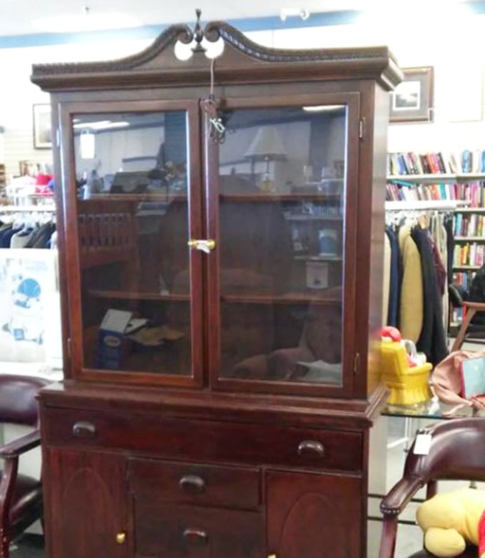 This isn't just furniture—it's time travel. A handcrafted china cabinet that whispers of Sunday dinners and family heirlooms, waiting for its next home.