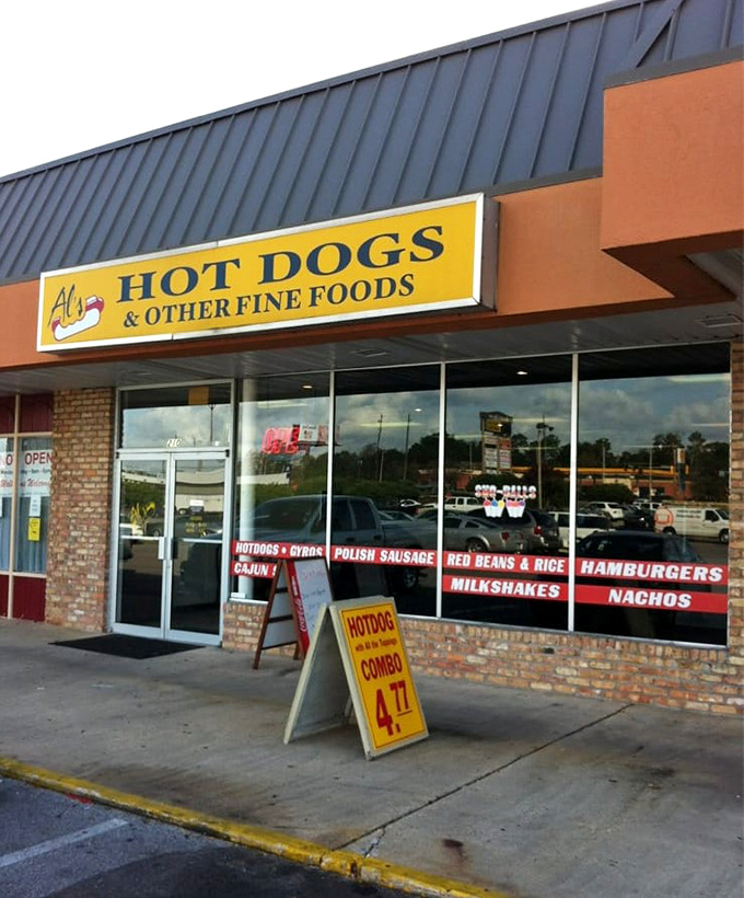 Al's bright yellow sign cuts right to the chase—hot dogs are the star, but there are "other fine foods" for the adventurous.