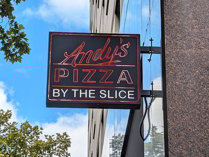 Andy's bold sign promises pizza by the slice - the universal language of "I need food now!"