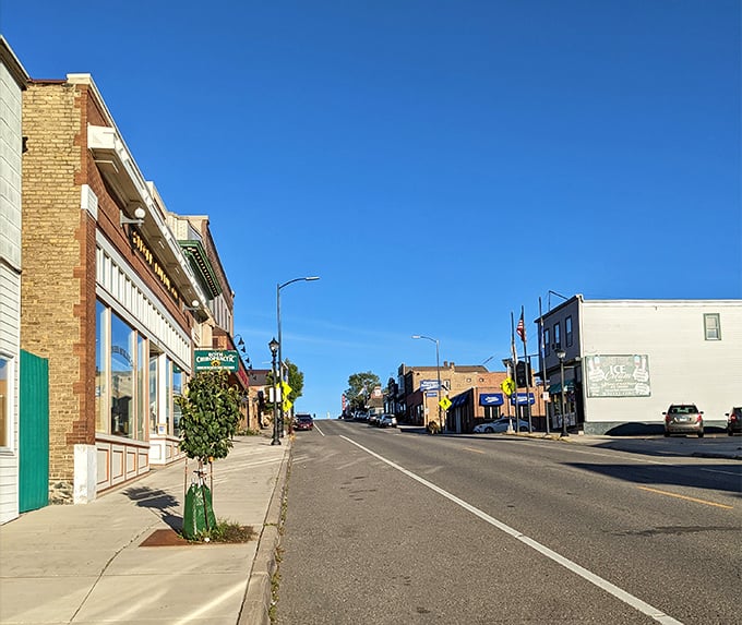 Ely's charming main street invites visitors to explore local shops and eateries under Minnesota's brilliant blue skies.