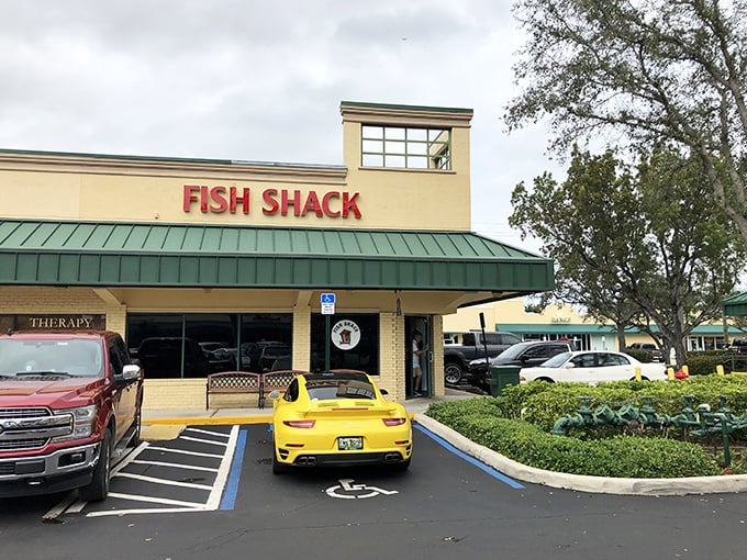 The yellow sports car parked outside Fish Shack creates the perfect Florida contrast—flashy on the outside, but inside it's all about substance over style.