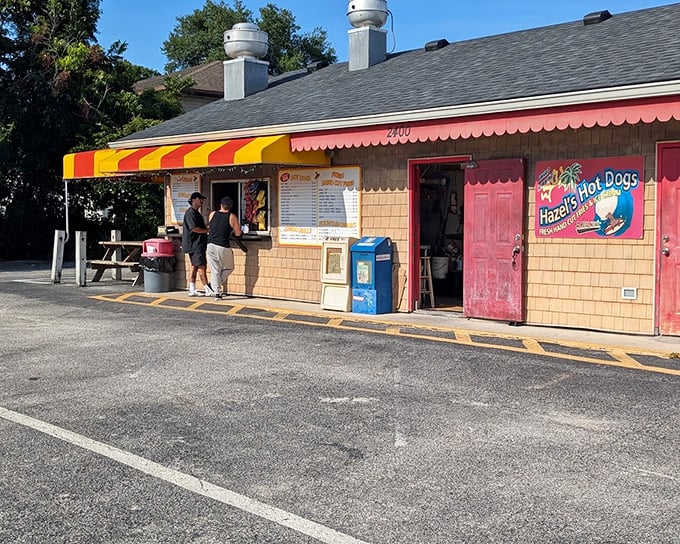 Hazel's striped awning has sheltered generations of hot dog lovers – proof that sometimes the simplest pleasures have the most staying power.