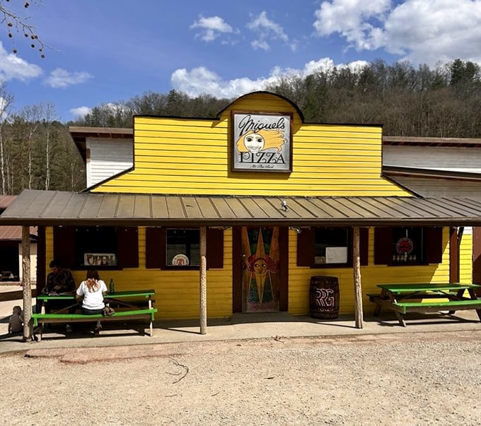 Miguel's sunshine-yellow façade stands out against Kentucky's natural beauty like a pizza paradise in the wilderness.