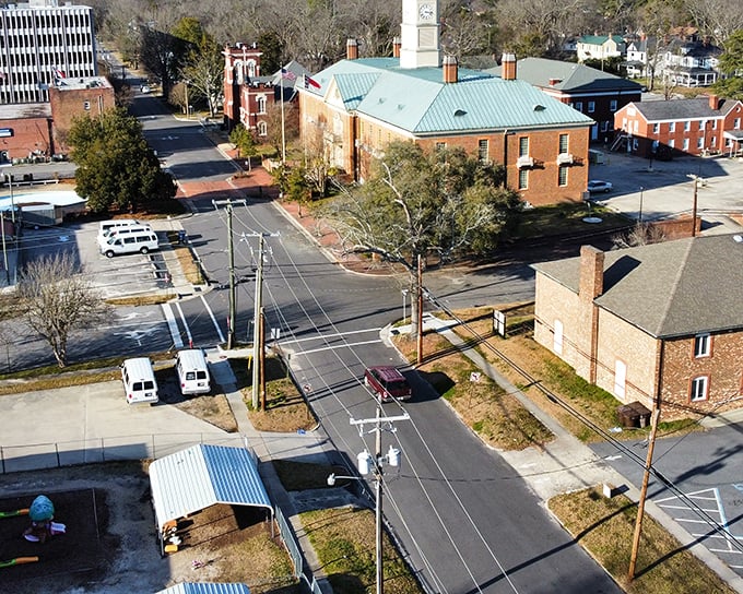 Tarboro’s historic charm shines from above, with tree-lined streets, brick buildings, and a timeless courthouse at its heart.