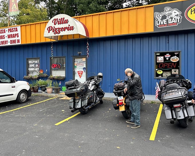Villa Pizzeria's blue exterior might seem unassuming, but those motorcycles outside tell you it's worth stopping for – bikers know good pizza!