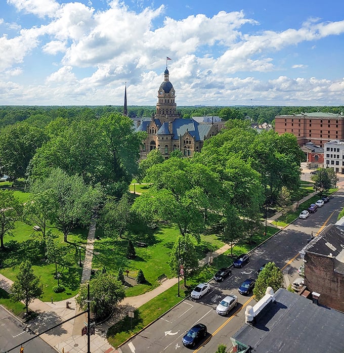 Warren’s beautiful courthouse stands tall above the trees, surrounded by lush greenery and classic charm on a sunny afternoon.