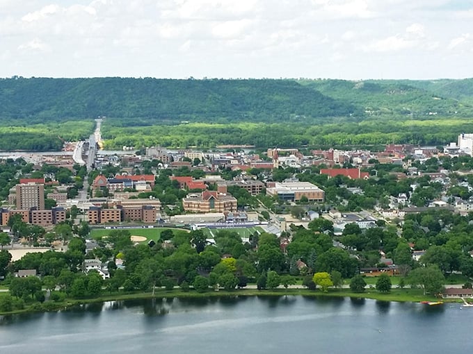 College town energy meets Mississippi River majesty in a community where bluffs create dramatic backdrops daily.