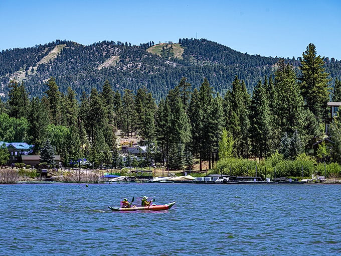 Kayakers enjoy Big Bear Lake's crystal waters with mountain views in every direction. Nature's theme park without the entrance fee!
