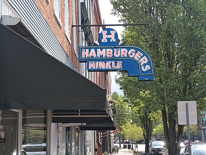 A slice of Americana! Hinkle's iconic blue sign hanging from this historic brick building is like a time portal to when sandwiches were simple but sublime.