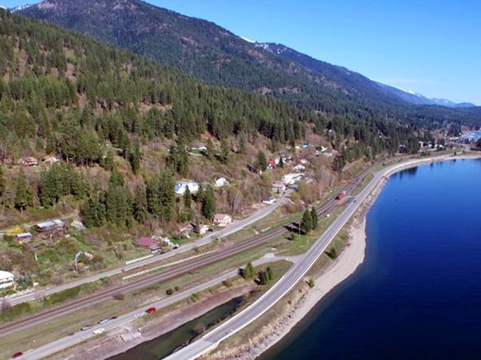 Hope clings to the shores of Lake Pend Oreille – where the water reflects mountains like nature's perfect mirror.