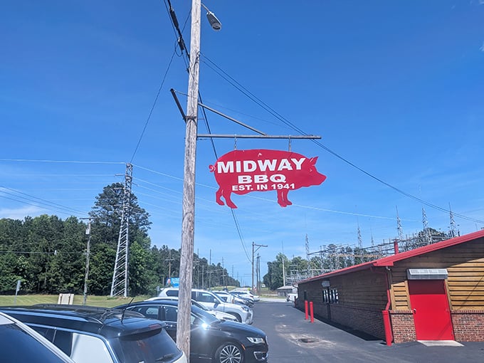 Wooden walls, red trim, and a parking lot full of cars – all signs you've found barbecue worth traveling for.