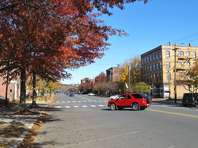 Fall's fiery display frames Montague's streets, where affordable living lets you rake in savings faster than autumn leaves.