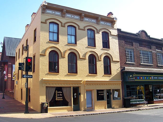 This butter-yellow building adds cheerful warmth to the historic streetscape like sunshine itself.