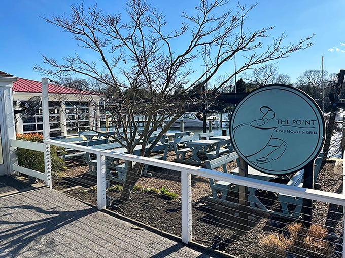 Winter can't dim The Point's waterfront charm. Where bare trees frame boats waiting for warmer days.