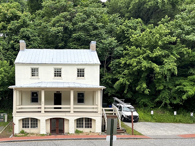 This pristine white building whispers tales of simpler times, its porch offering a front-row seat to Harpers Ferry's ongoing historical show.