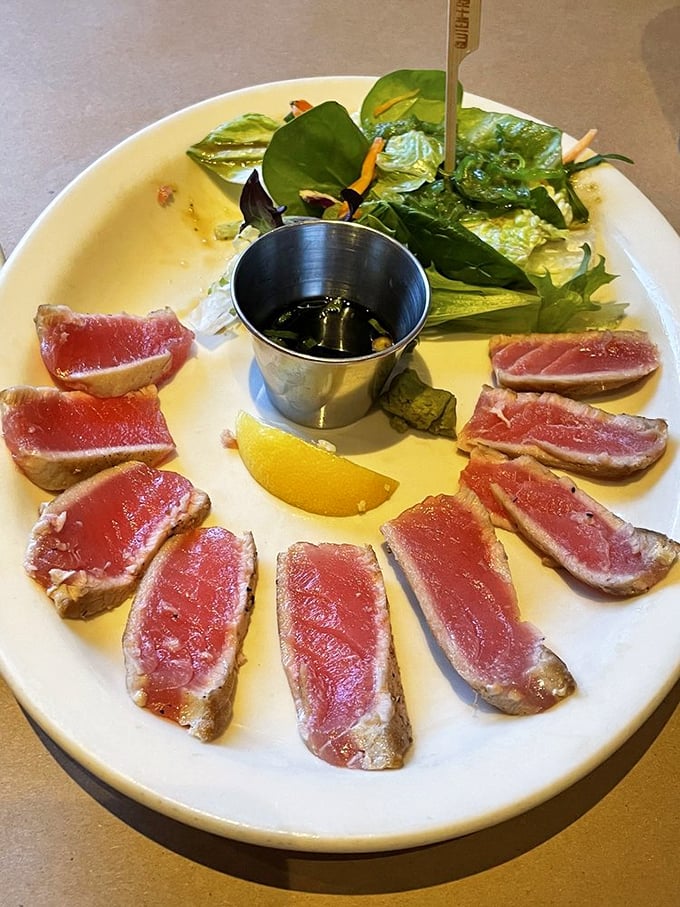 Seared ahi tuna, ruby-red and arranged like a delicious clock face. The kind of dish that makes you pause mid-conversation to simply appreciate life.
