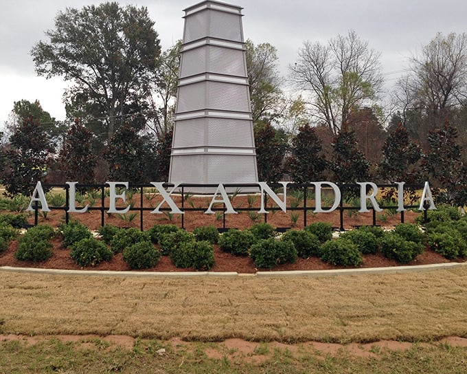 The Alexandria welcome sign stands tall, greeting visitors with Southern charm and the promise of affordability—a combination worth writing home about.