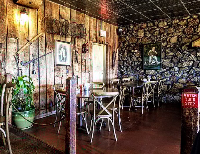 Stone walls meet wooden paneling in this dining area where "Watch Your Step" isn't just a sign – it's solid life advice.
