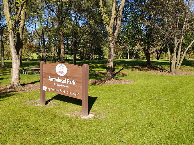 Arrowhead Park's entrance sign promises the simple pleasures of open green spaces—nature's antidote to doom-scrolling and inbox anxiety.