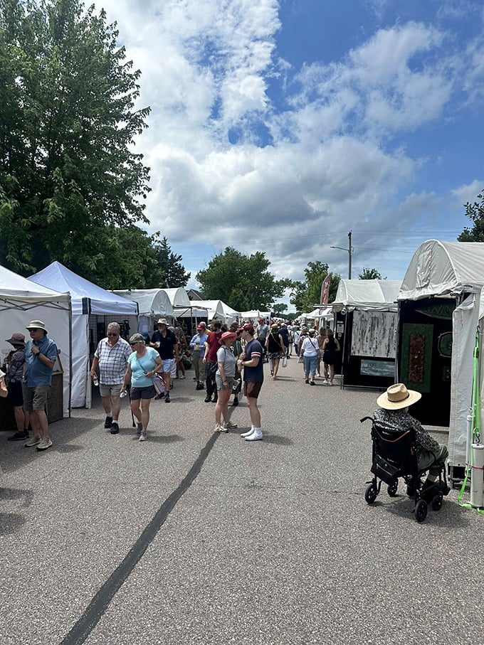 The local arts fair transforms parking lots into galleries, proving creativity thrives where there's room to breathe and neighbors who appreciate it.