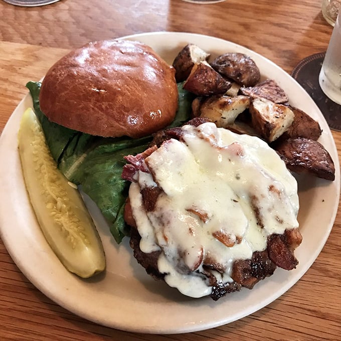 This isn't just a burger—it's a masterpiece with melted cheese as the crowning glory. Pickle on the side for that perfect tang.