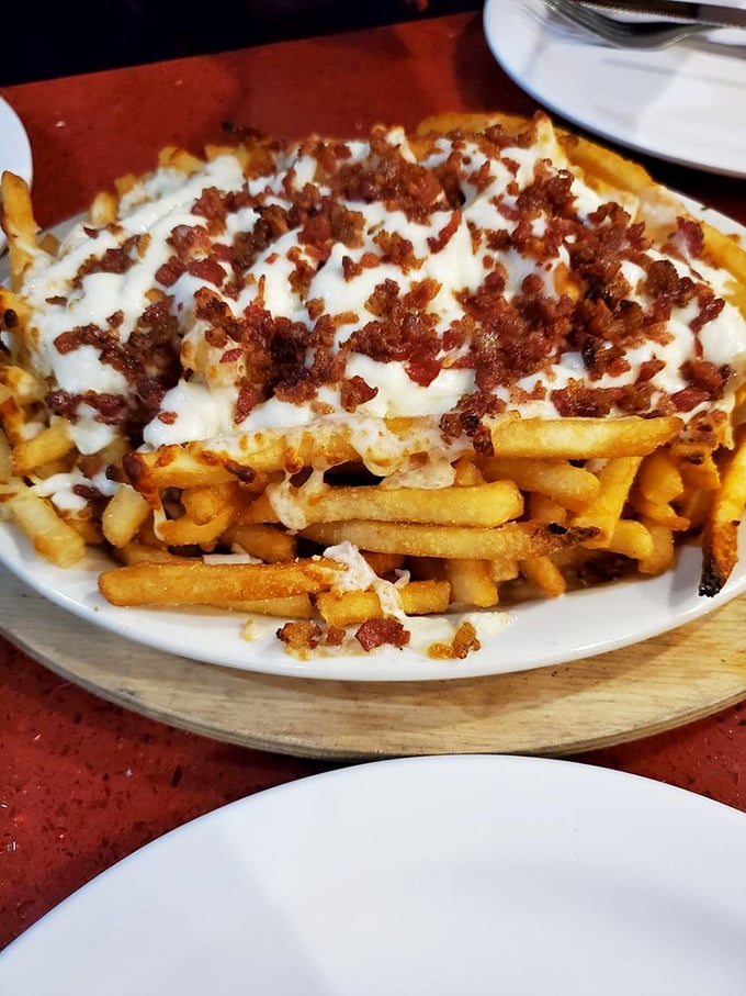 These aren't just cheese fries—they're a loaded potato masterpiece that makes you question why you'd eat fries any other way.