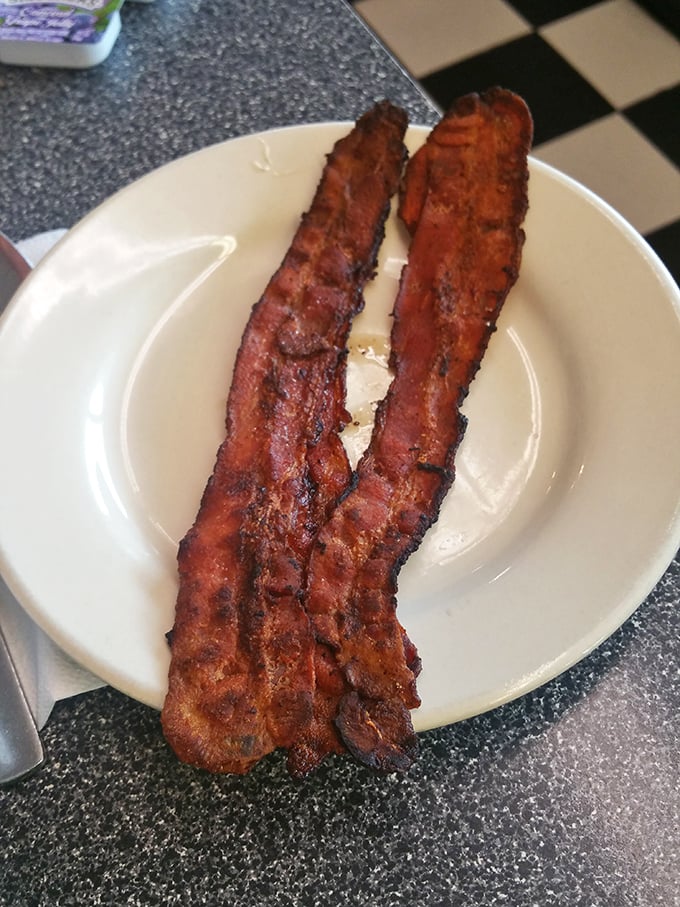 Bacon at Kuppy's isn't an afterthought—it's two substantial strips of perfectly rendered pork that remind you why bacon became breakfast royalty in the first place.