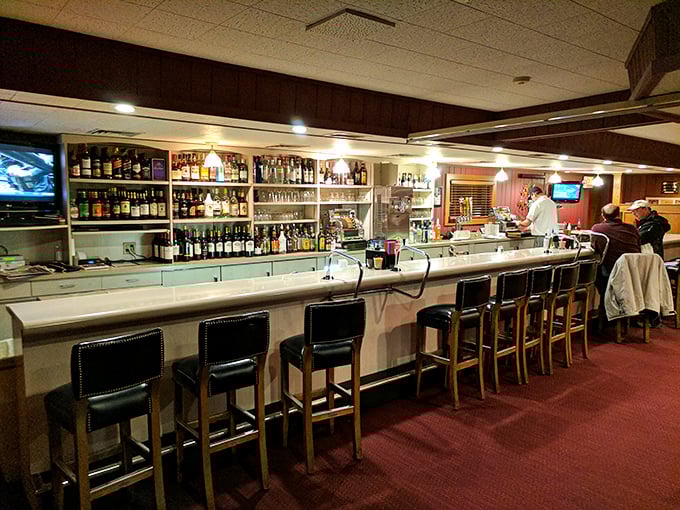 A bar that knows exactly what it's doing—no mixology theatrics needed. Those bottles aren't just spirits—they're old friends waiting to be reacquainted.