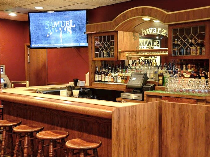 Where libations flow freely. The classic wooden bar with its impressive selection stands ready to craft your perfect pre-dinner Wisconsin Old Fashioned.