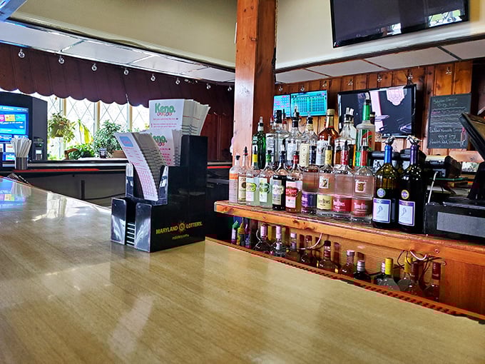 The bar at Schultz's—where cold drinks flow and strangers become friends over shared appreciation of properly prepared crustaceans.