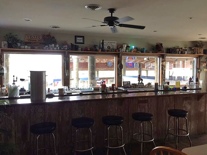 The bar at JP's—where stories flow as freely as the drinks. Maritime memorabilia lines the shelves, creating the perfect backdrop for coastal libations.