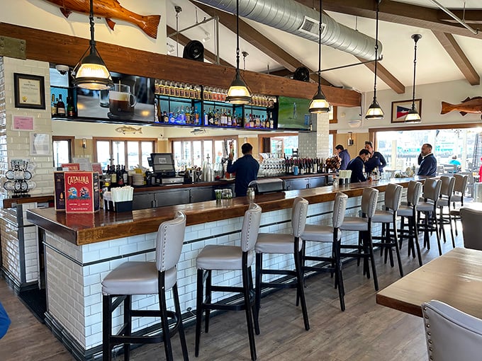 The bar at Bluewater Avalon isn't just a place to order drinks—it's command central for spectacular harbor views and seafood dreams.