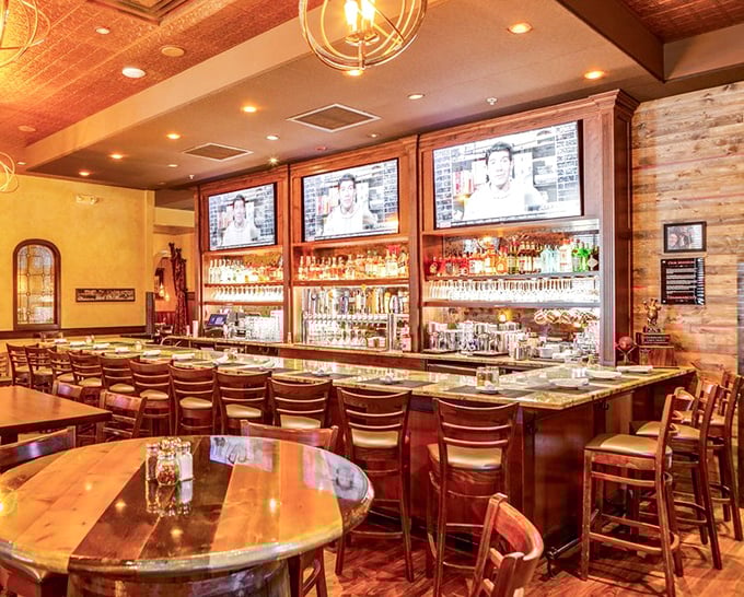 The bar gleams with promise – each bottle a potential adventure, each barstool a front-row seat to the liquid artistry that complements your meal.
