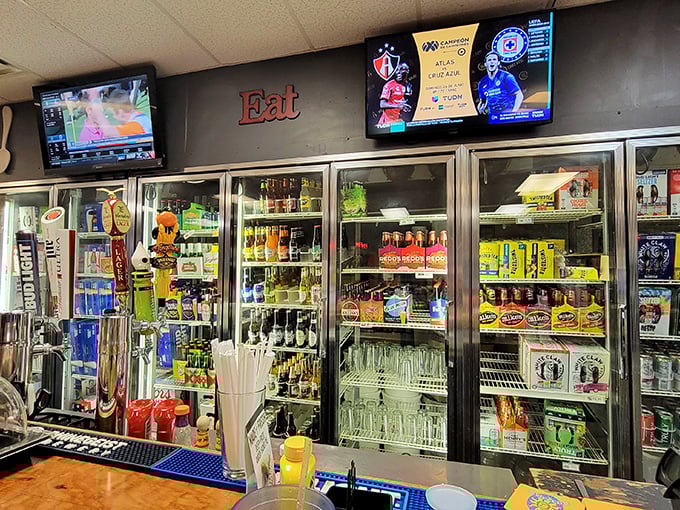 The "Eat" sign says it all. This beverage station isn't just stocked – it's an oasis of options waiting to quench your post-burger thirst.
