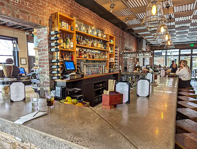 The bar doesn't just serve drinks—it showcases them against exposed brick like liquid art installations waiting to be appreciated.