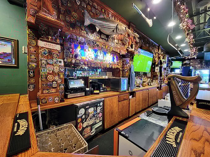 The bar area showcases decades of collected memories—patches, flags, and memorabilia creating an atmosphere that feels earned rather than manufactured.