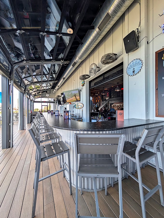Indoor-outdoor living at its finest with a corrugated metal bar that brings industrial chic to waterfront dining. The perfect spot for a cold craft beer.