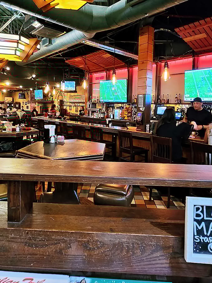 The bar area: where strangers become friends over shared pizza appreciation and sports commentary.