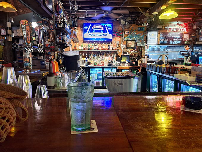 The bar area—where fishing tales grow taller, friendships form faster, and nobody's checking their watch or their stock portfolio.