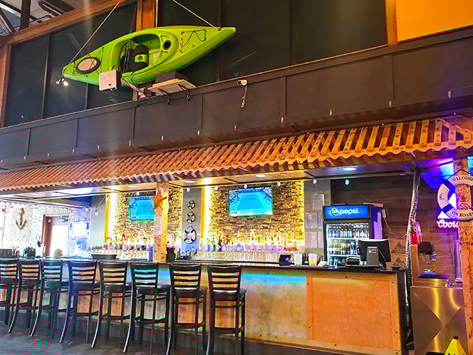 The bar area glows with promise—a front-row seat to where beer is poured cold and seafood dreams come true.