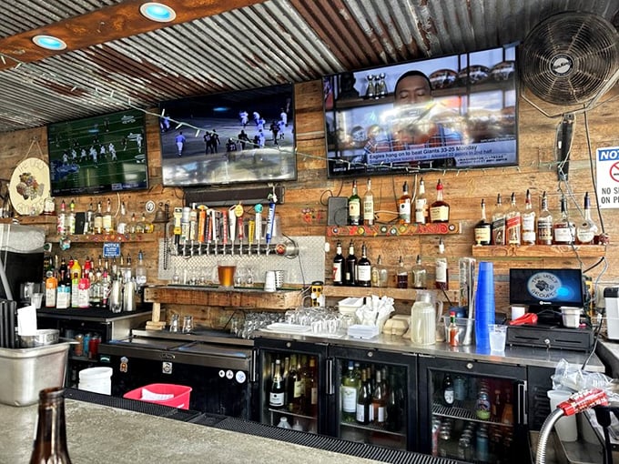 The bar area strikes that perfect balance between "professional drinking establishment" and "your coolest friend's backyard tiki setup."