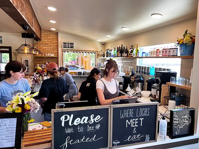 "Please wait to be seated" at the counter where locals meet and eat—the heart of any great neighborhood café.