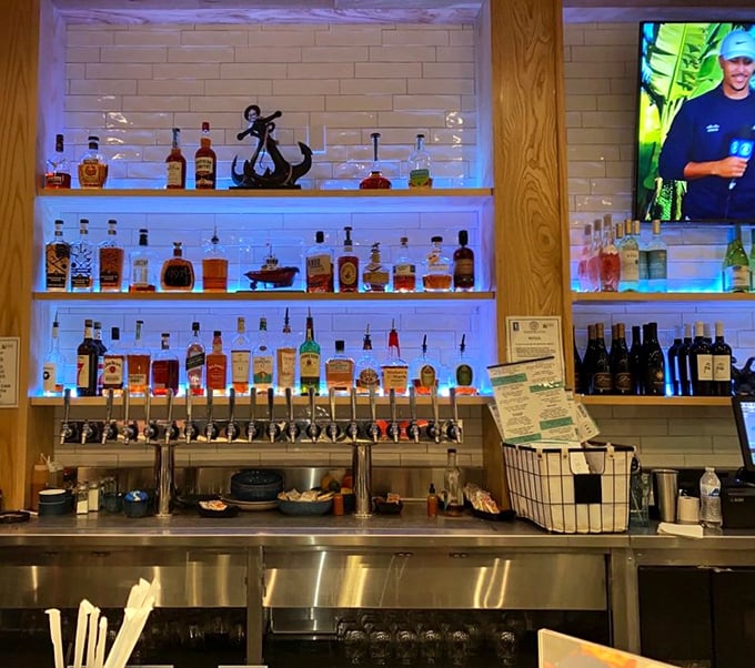 The bar area glows with amber bottles and nautical touches – like the world's most sophisticated ship captain decided to open a watering hole.
