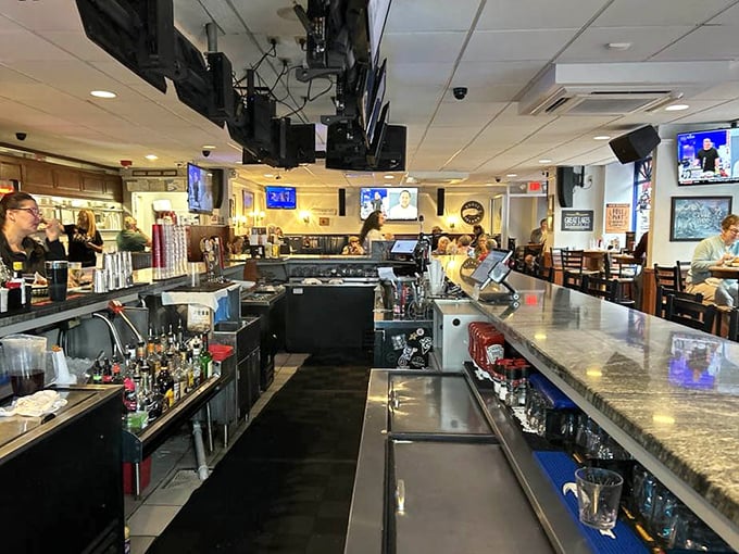The bar area—where liquid courage flows freely and strangers become friends over shared plates and baseball debates.
