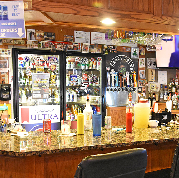 Sally's bar area—where local news travels faster than the WiFi and the beer is always cold enough to fog your glasses.